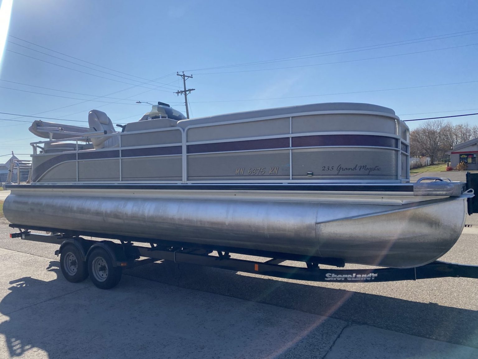 Premier Tri-toon w/Newer Motor and Brand New Upholstery! - Hallberg Marine